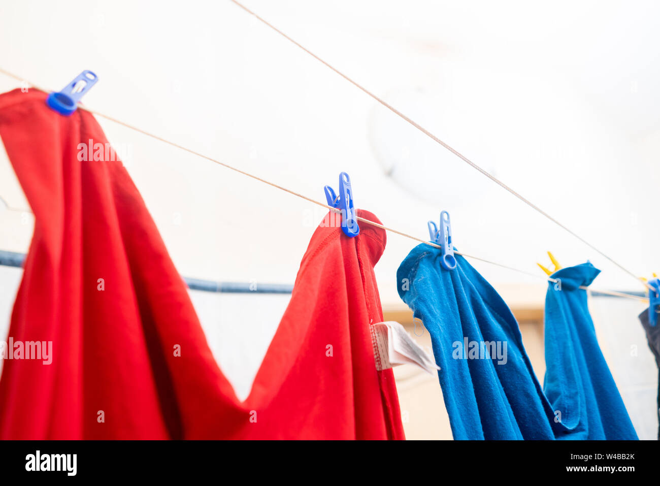 drying the clothes hanging in laundry, hanging after washing Stock ...