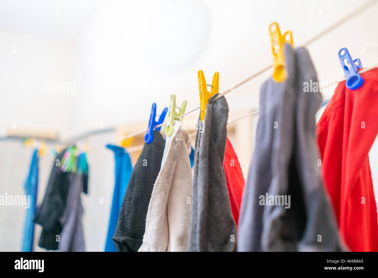 drying the clothes hanging in laundry, hanging after washing Stock ...