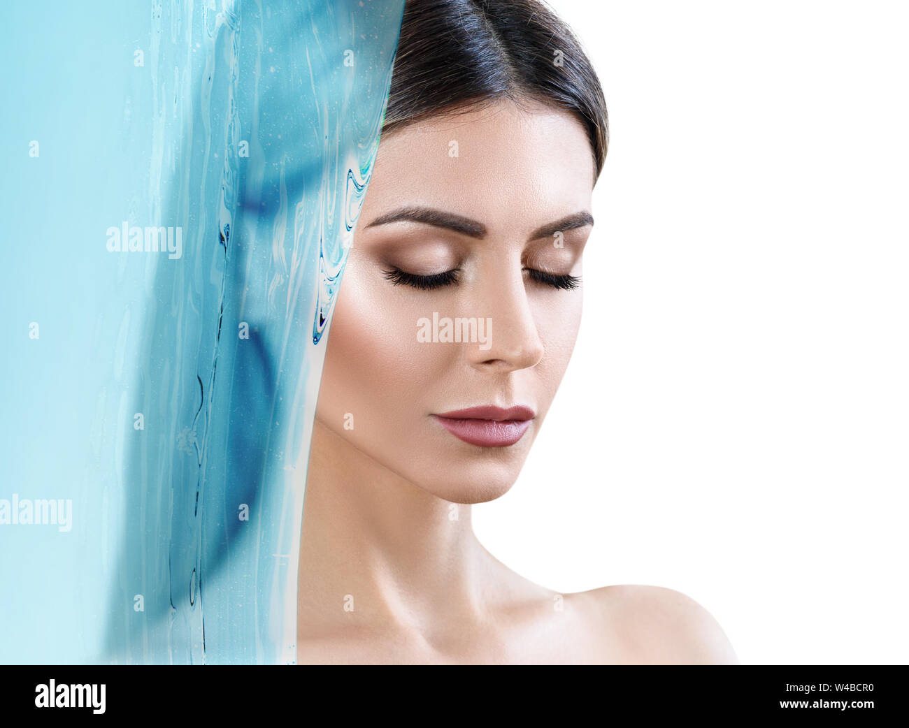 Sensual woman under water splash over white background Stock Photo - Alamy