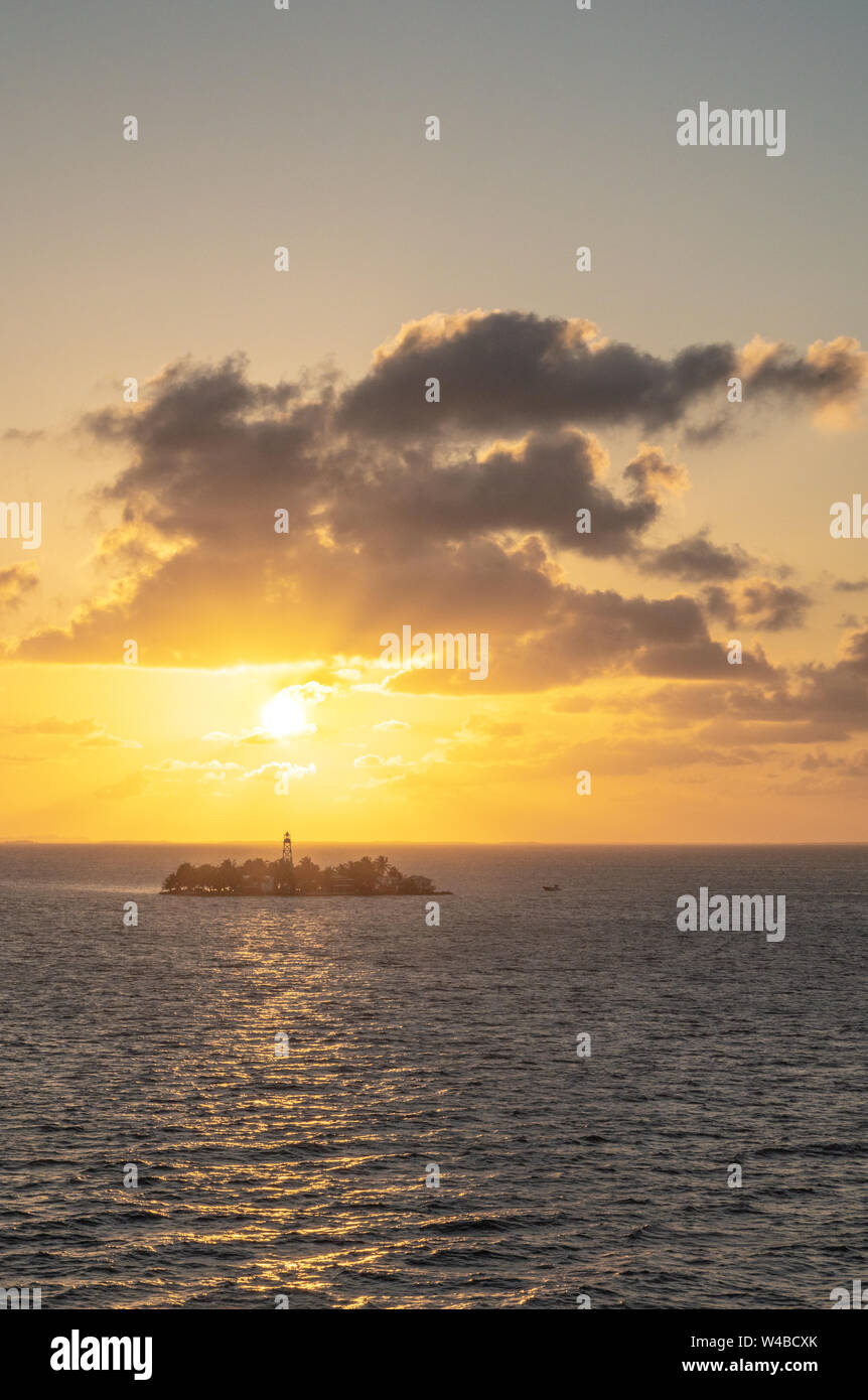 Dramatic sunset over small island in Bahamas island Belize during ...