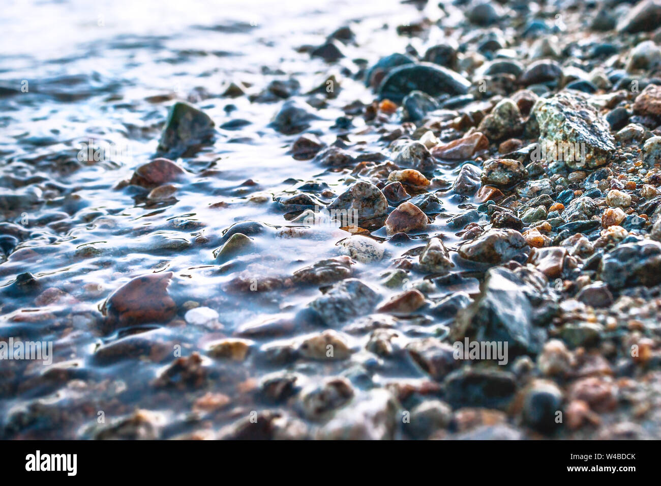 Pebbles in water hi-res stock photography and images - Alamy