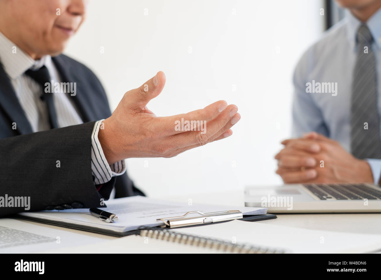 Confident insurance agent broker man holding document and present ...