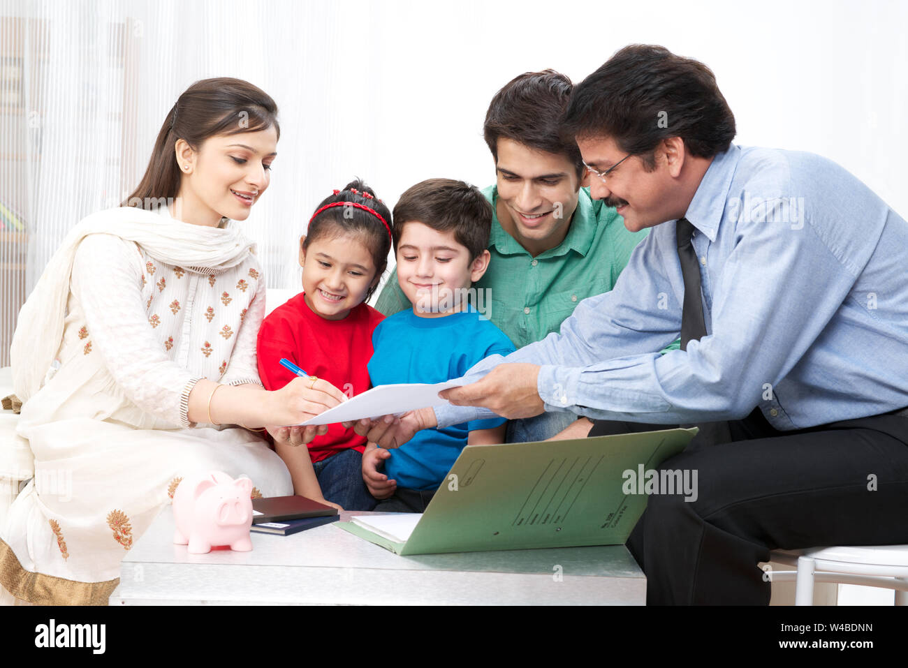 Bank executive taking signature of a woman Stock Photo - Alamy