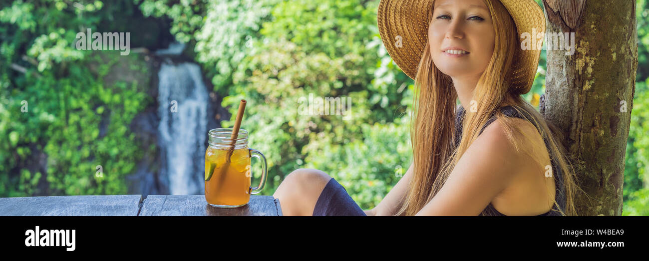 Closeup portrait image of a beautiful woman drinking ice tea with ...