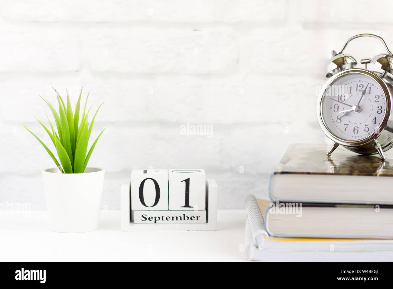 September 1 on a wooden calendar next to the alarm clock,the concept of ...