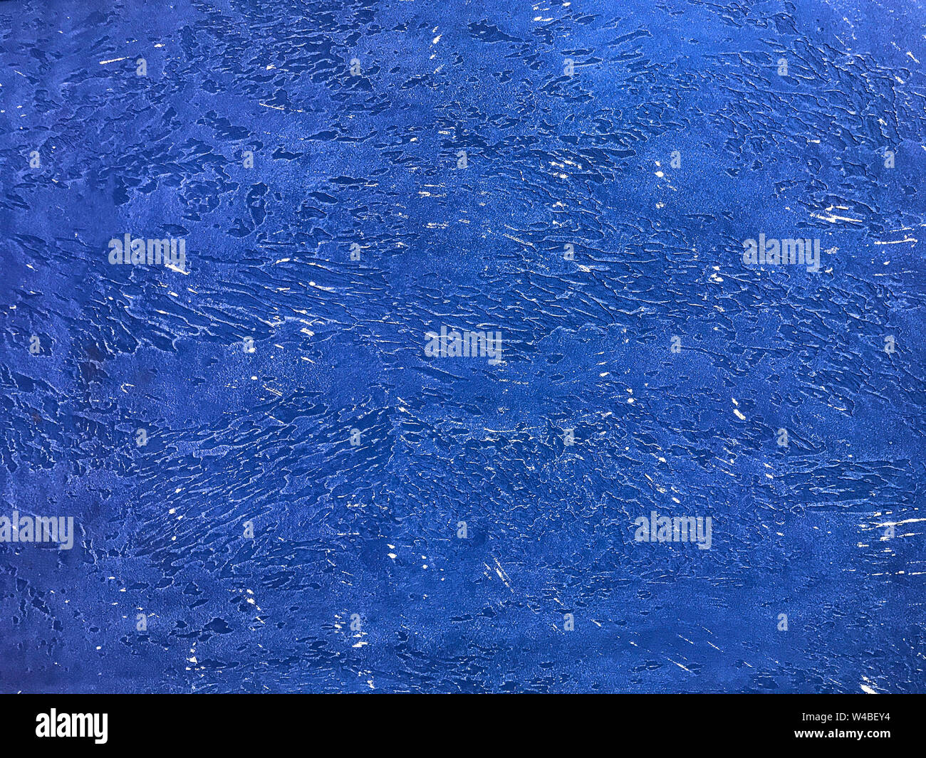 Decorative navy blue shabby peeling plaster in vintage style. Texture ...