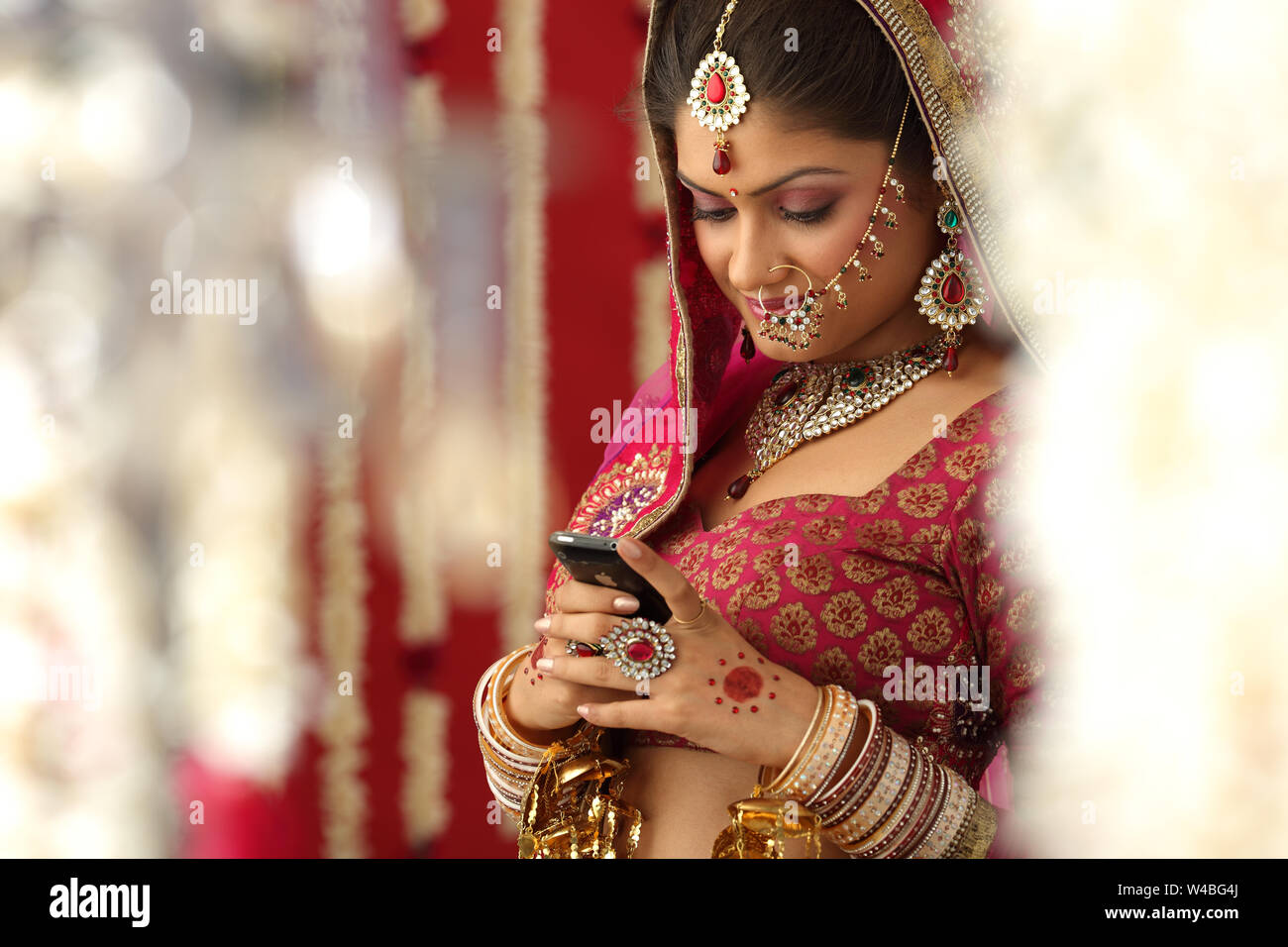 Indian bride text messaging hi-res stock photography and images - Alamy