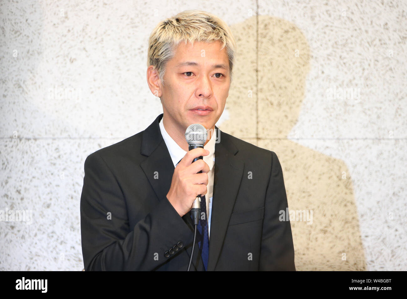Japanese comedians Ryo Tamura and Hiroyuki Miyasako (unseen) attend a ...