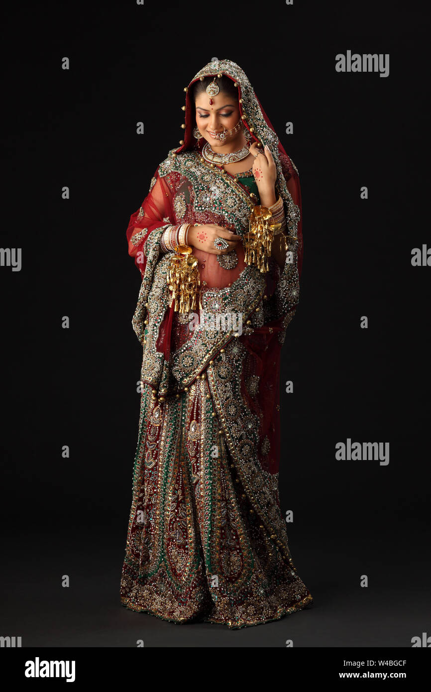 Indian bride standing Stock Photo - Alamy