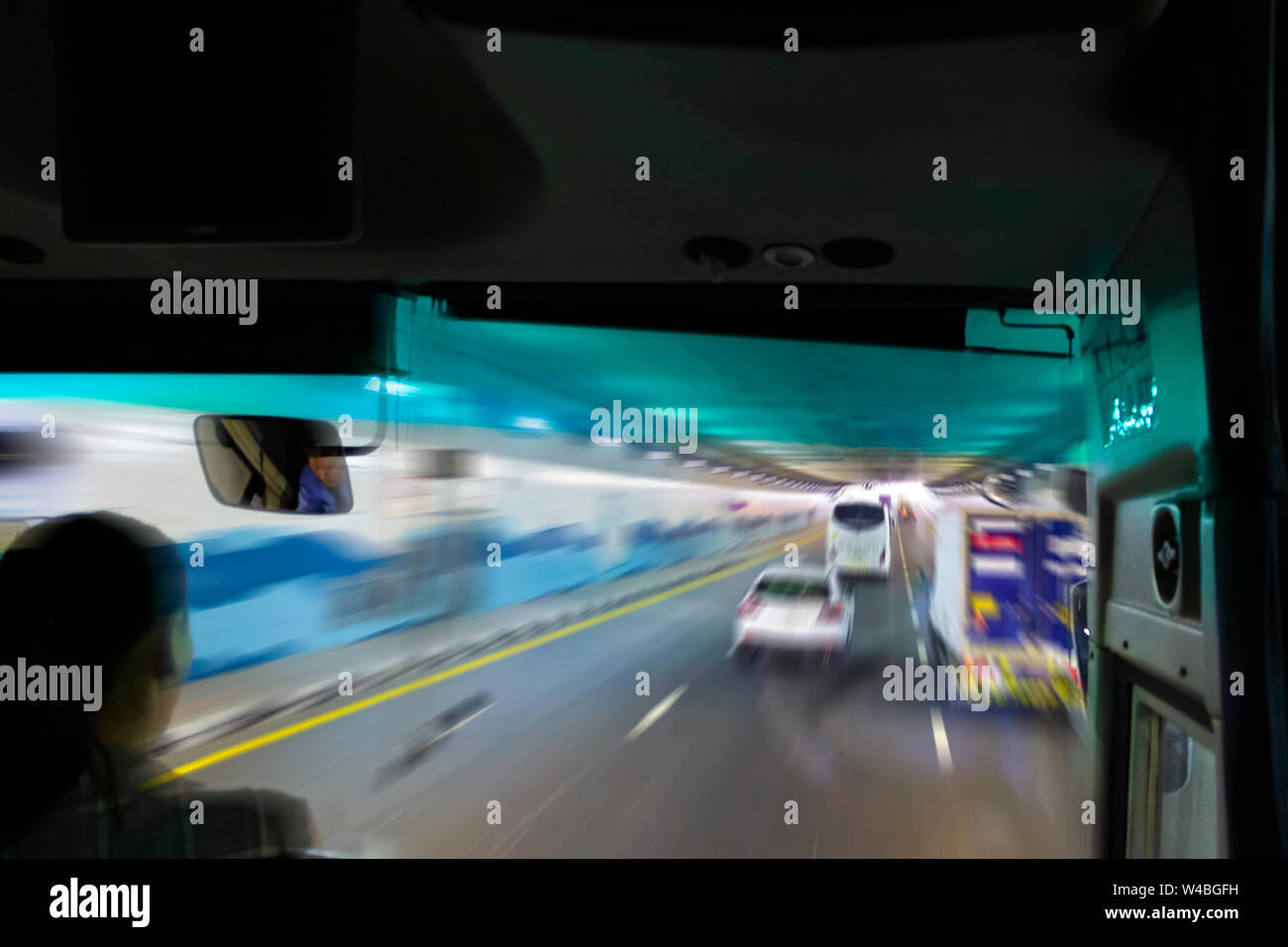 Urban roads through the front window of the bus as abstraction. Motion ...