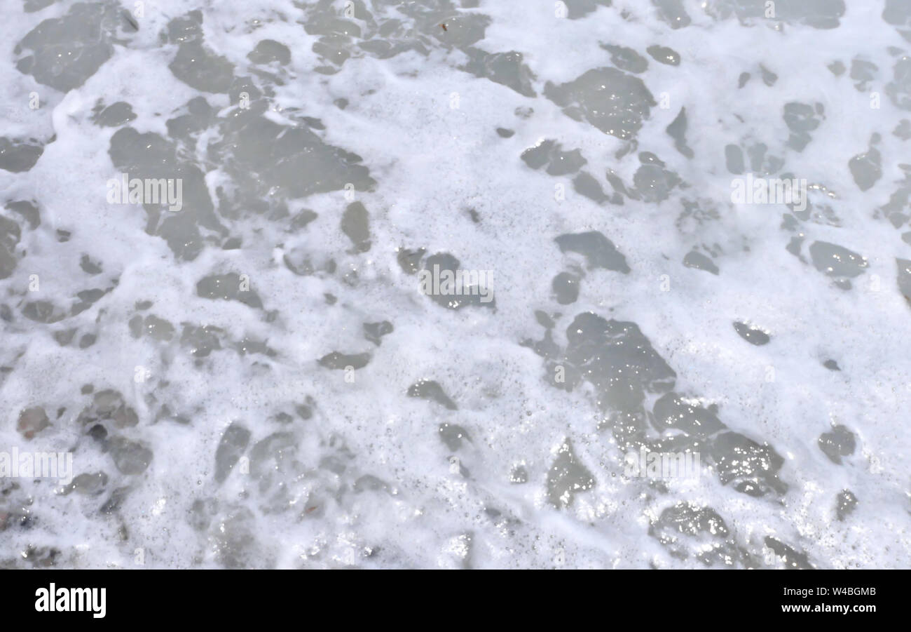 White foam on a sea water Stock Photo - Alamy