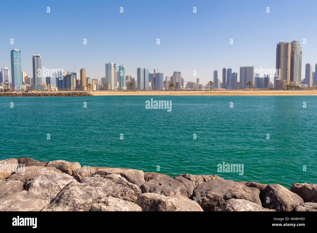 Modern city on the shores of the azure sea Stock Photo - Alamy