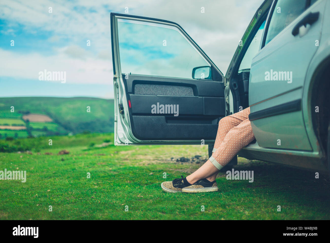 Legs of a woman sitting in car hi-res stock photography and images - Alamy