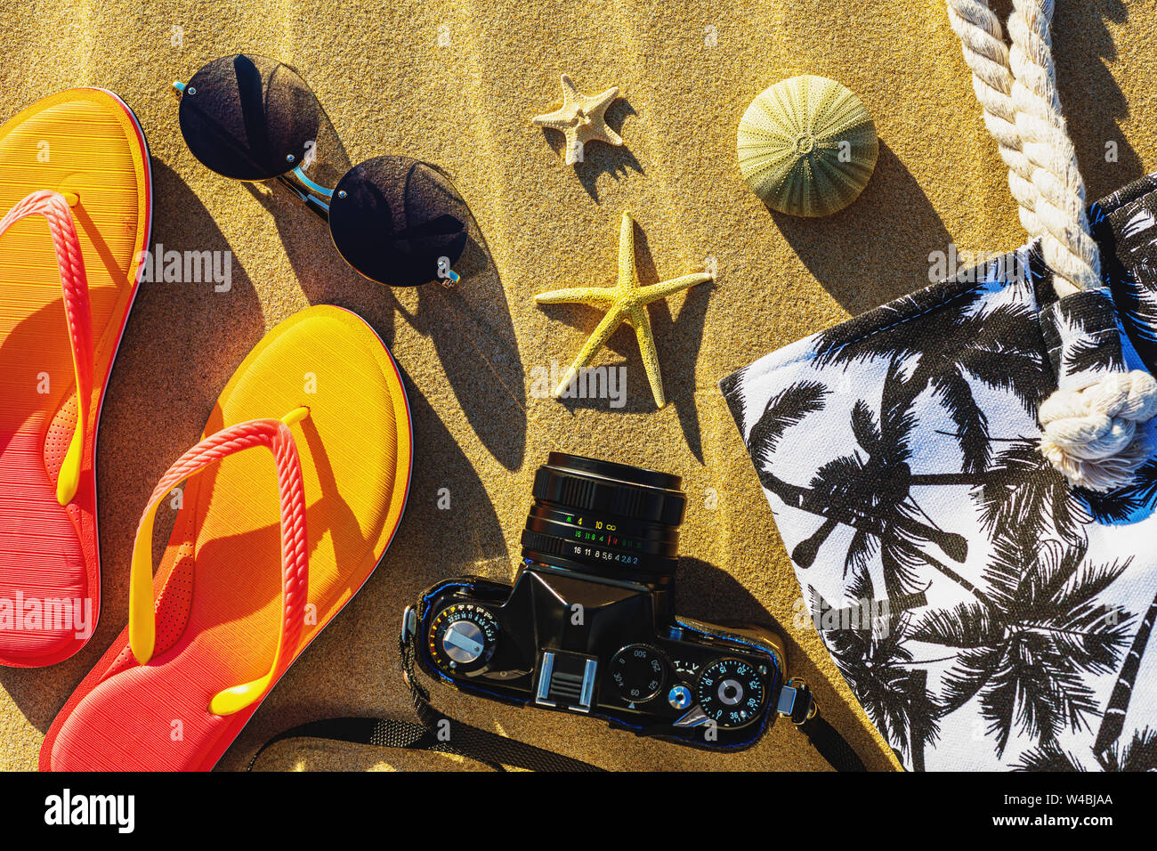Various beach items on sand, top view Stock Photo - Alamy