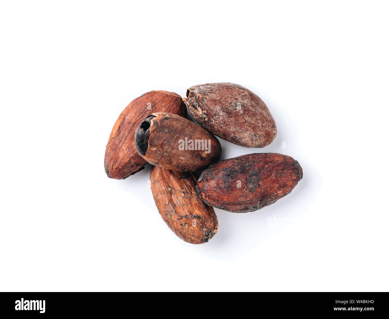 Raw cacao beans top view on white background. Close up view of raw ...