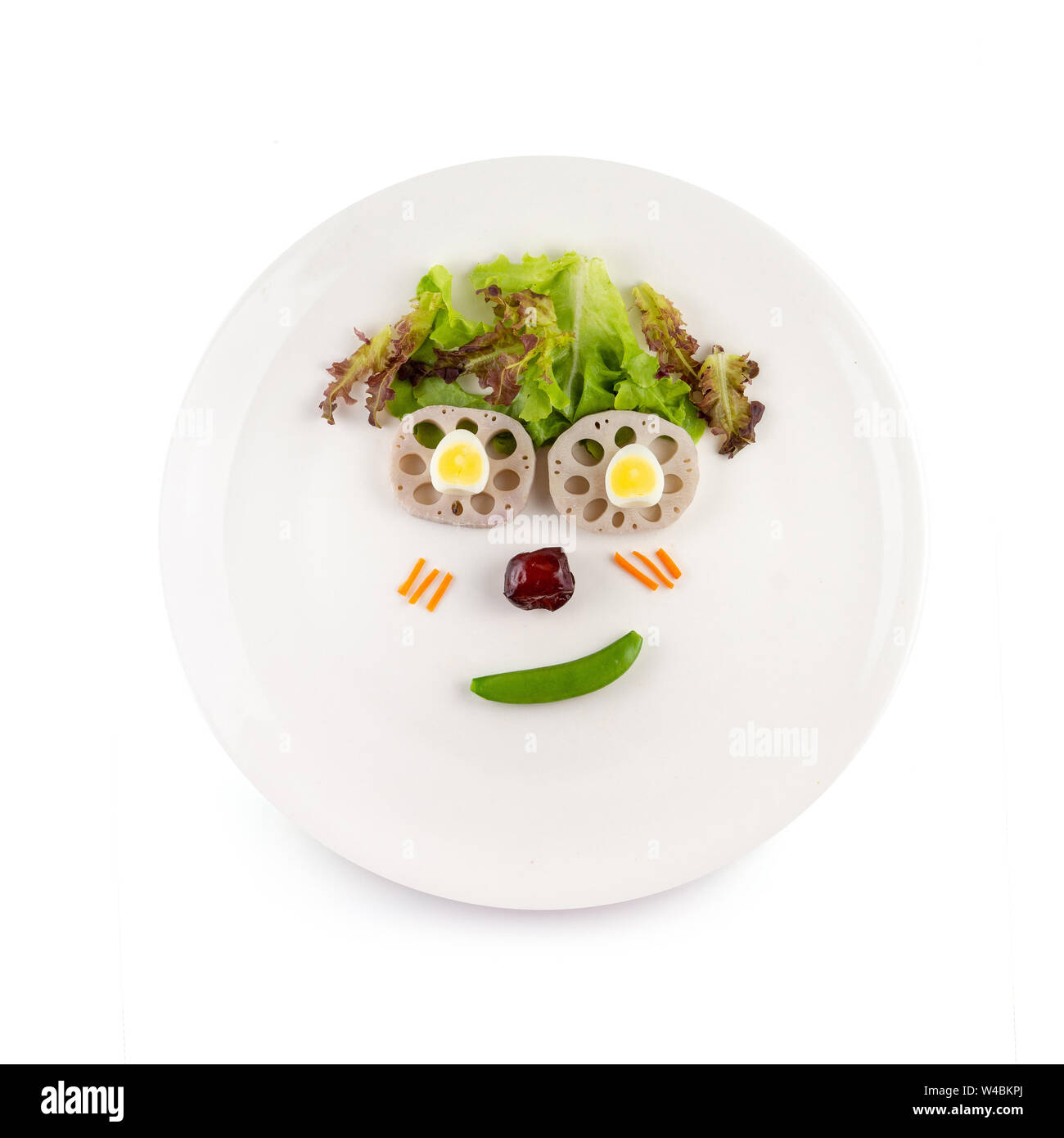 Fun food for kids - cute smiling clown face on salad decorated with ...