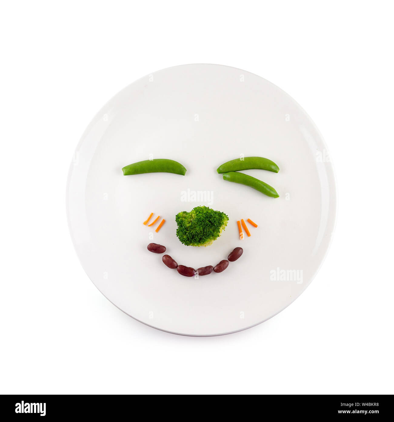 Fun food for kids - cute smiling clown face on salad decorated with ...