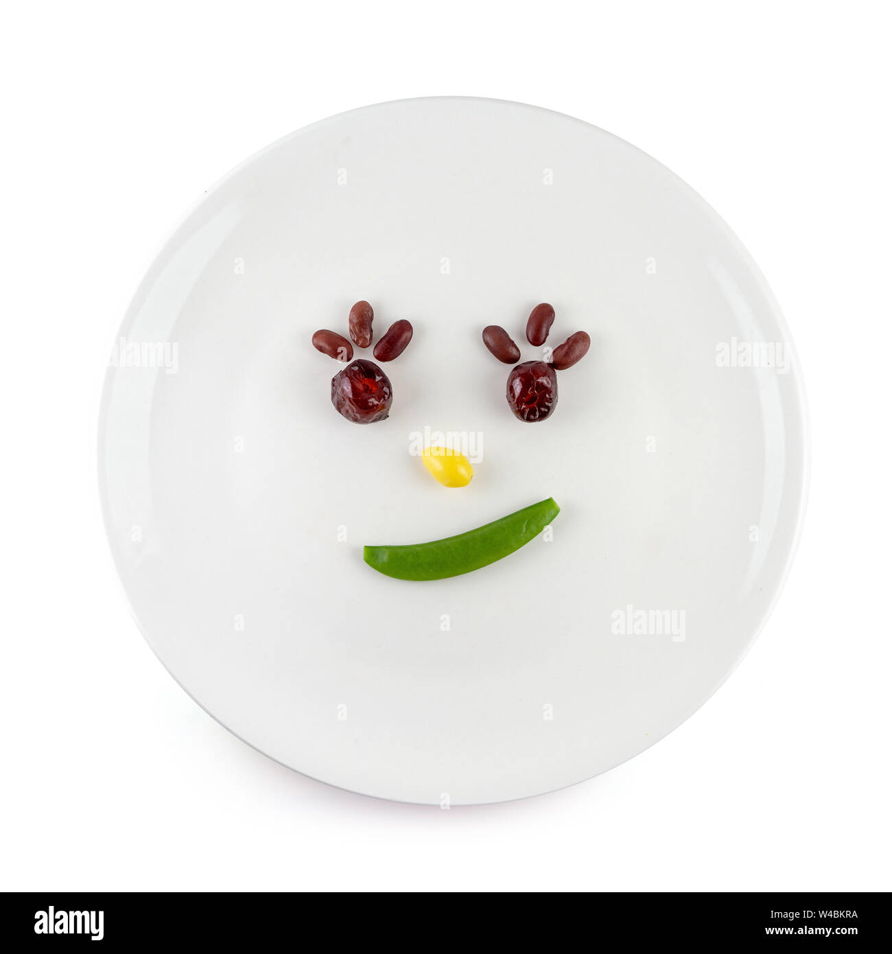 Fun food for kids - cute smiling clown face on salad decorated with ...
