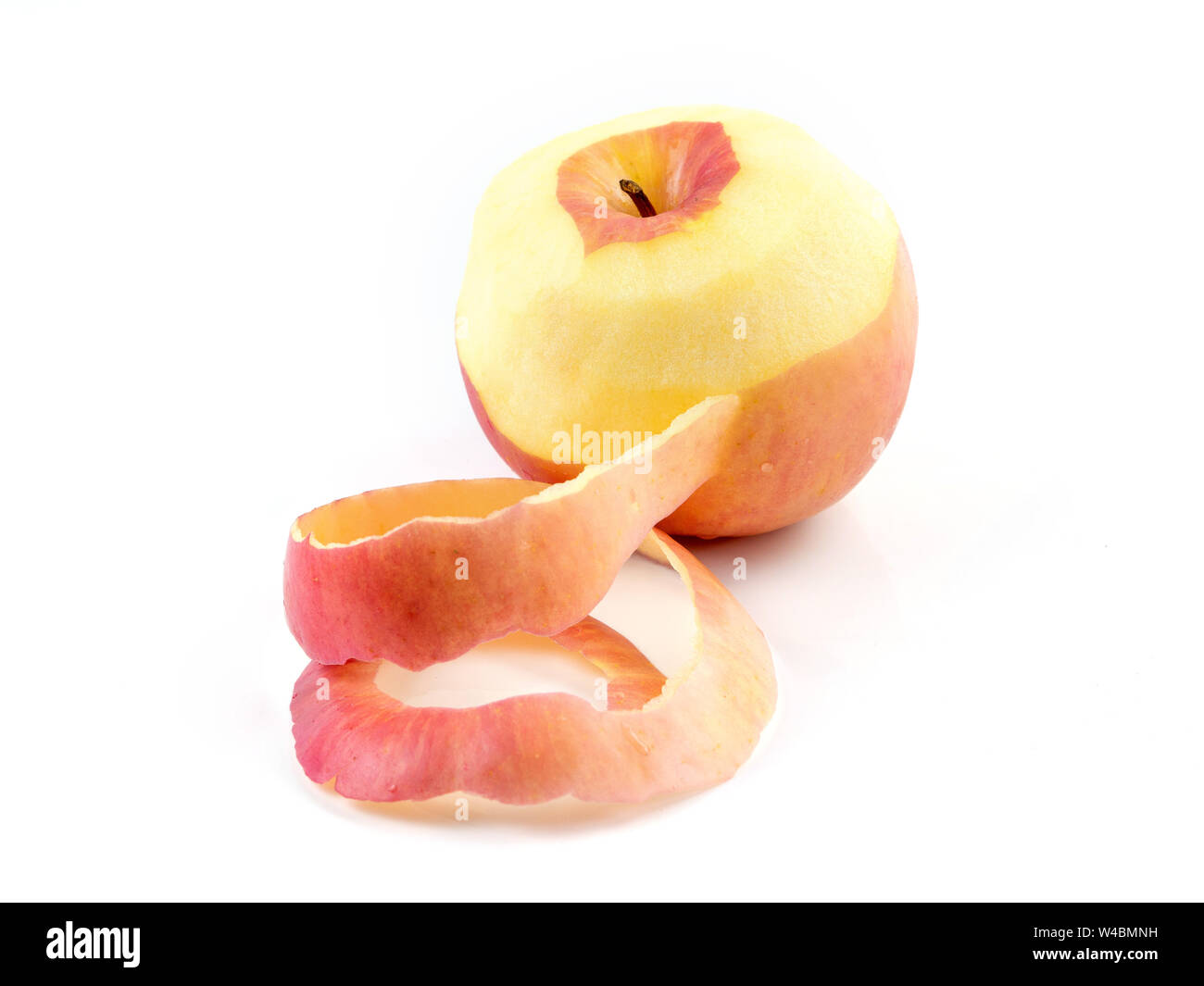 apple with peeled skin on white background Stock Photo - Alamy