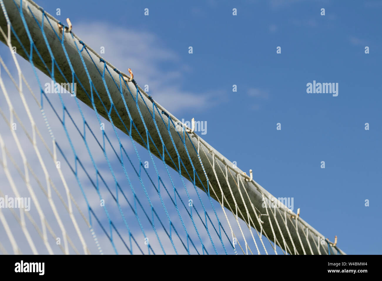 Close up football or soccer goal with blue sky. The old rusty football ...