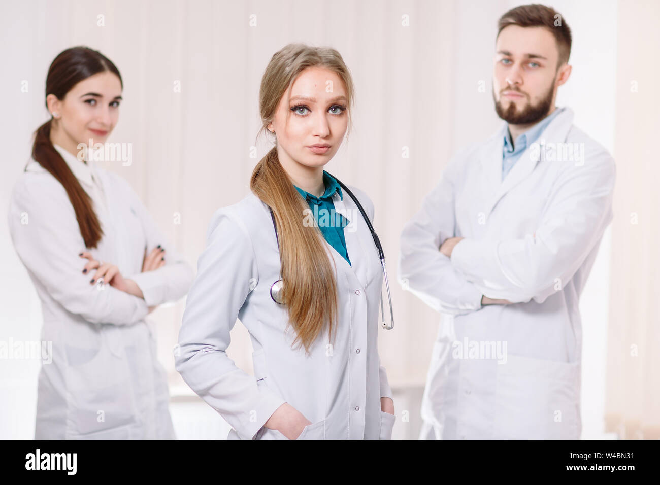 Portrait of doctors in white coats in the hospital ward Stock Photo - Alamy