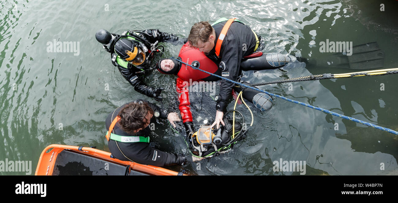 13 July 2019, Schleswig-Holstein, Wacken: Fire divers rescue a diver ...