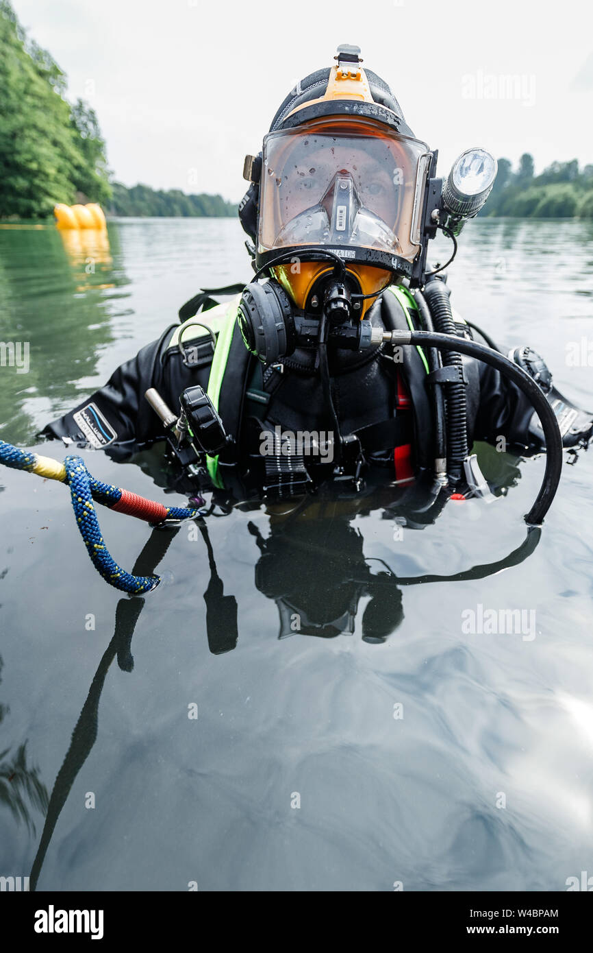 13 July 2019, Schleswig-Holstein, Wacken: A fire diver swims to his ...
