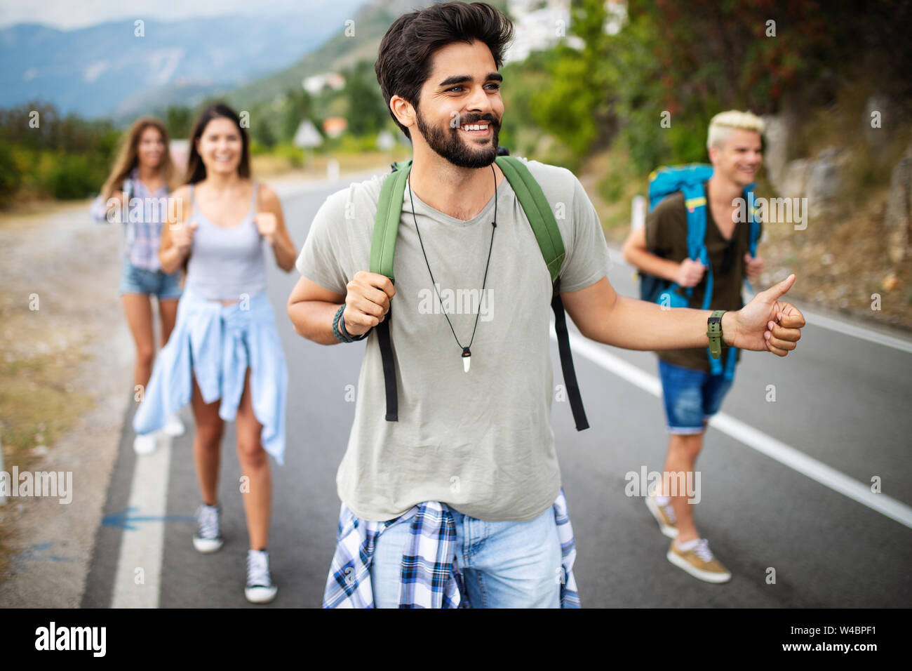 Group of happy friend traveler walking and having fun. Travel lifestyle ...