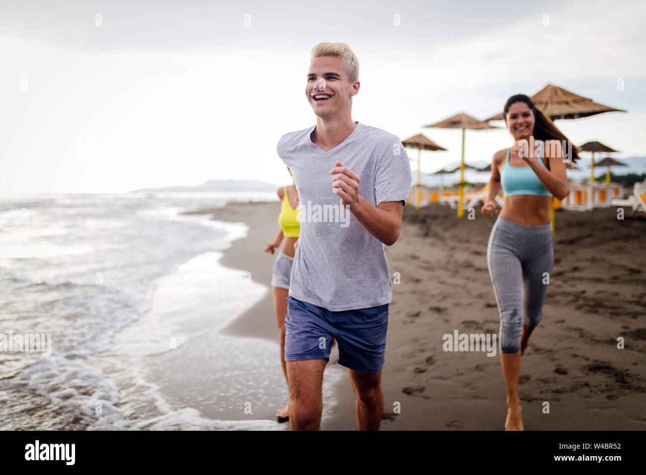 People run beach hi-res stock photography and images - Alamy