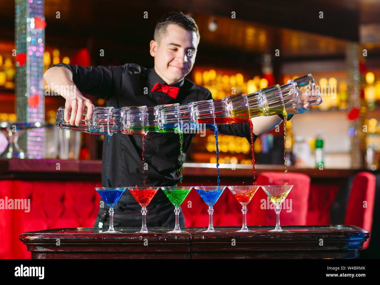 Barman show. Bartender pours alcoholic cocktails in a restaurant Stock ...