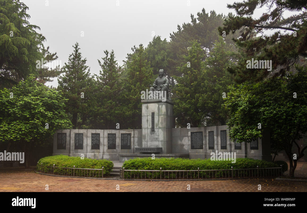 Statue of Choe Chiwon in Dongbaek Park on a foggy day. Central Monument ...