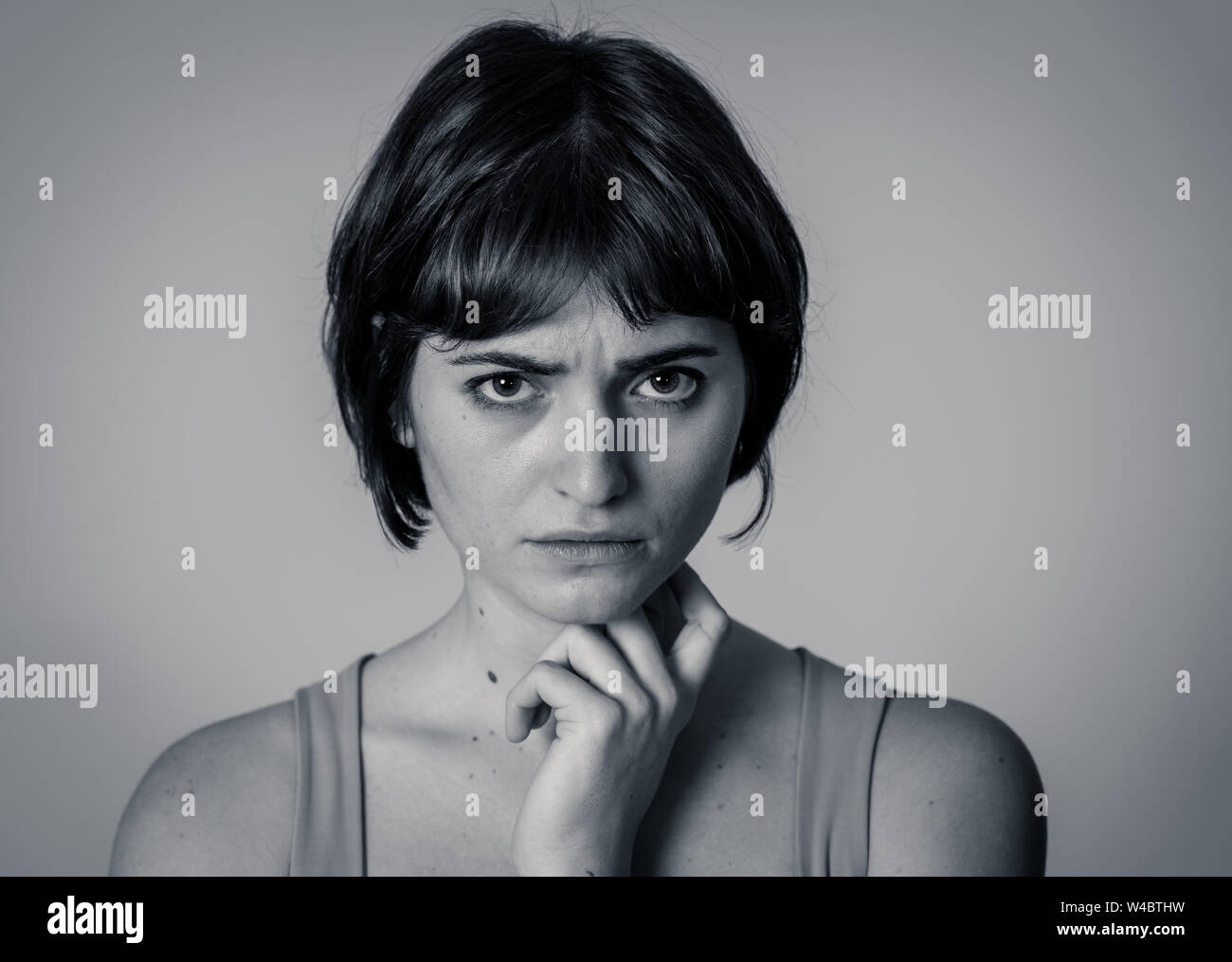 Black and white portrait of young sad woman, serious and concerned ...