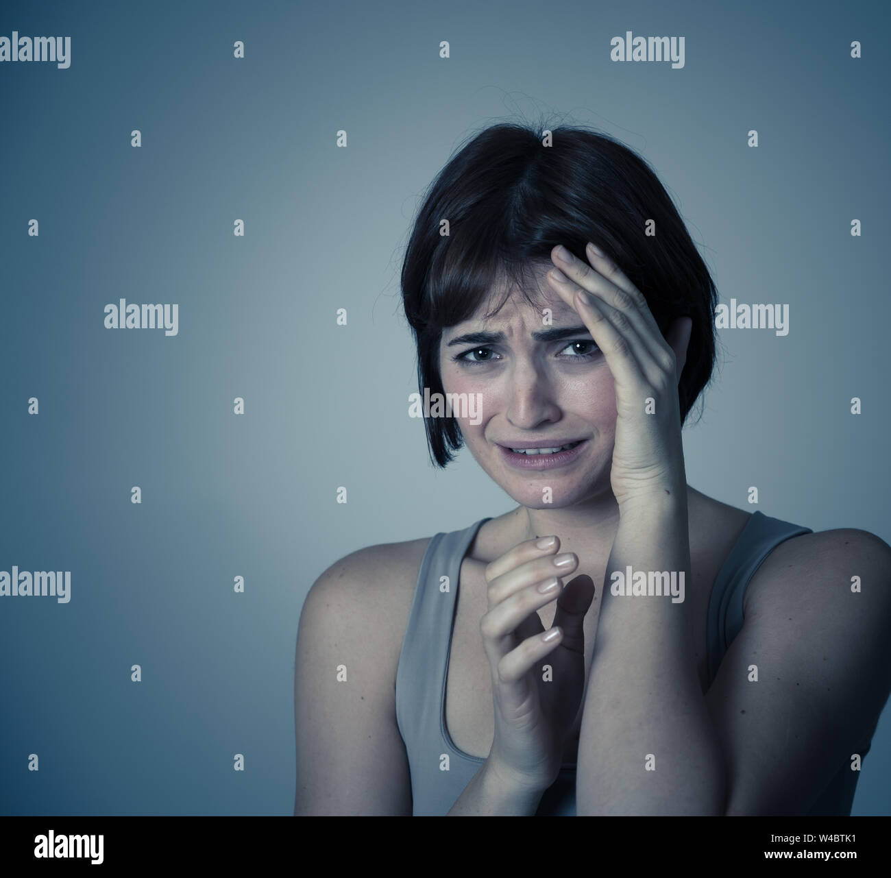 Portrait of young woman feeling scared and shocked making fear, anxiety ...