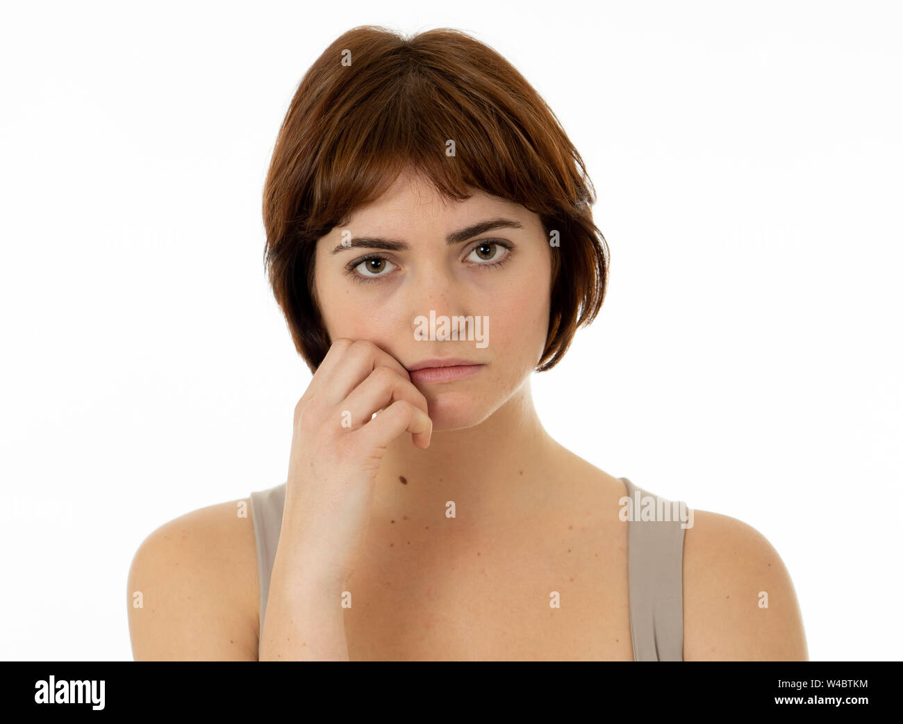 Close up portrait of young sad woman, serious and concerned, looking ...
