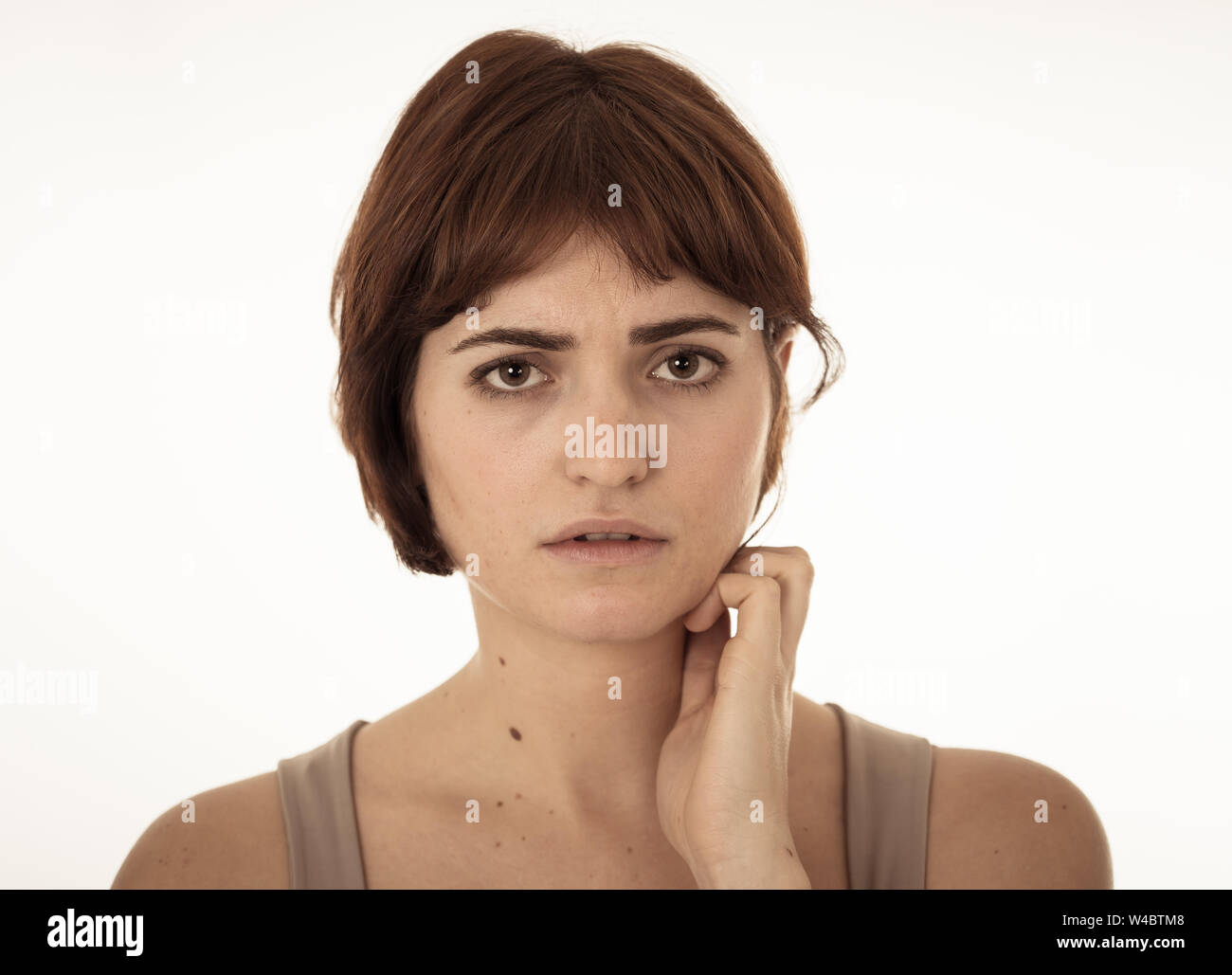 Close up portrait of young sad woman, serious and concerned, looking ...