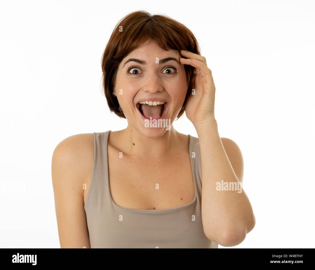 Portrait of beautiful shocked woman hearing good news or having great ...