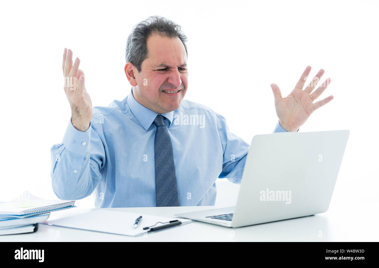 Angry and frustrated middle aged businessman overworked at desk upset ...