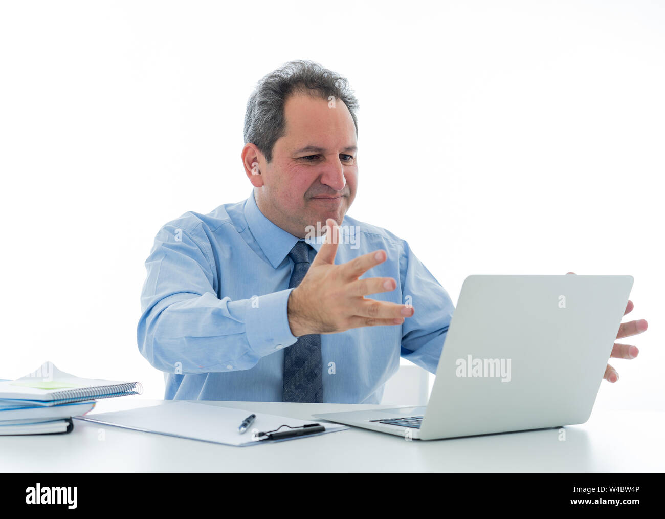 Angry and frustrated middle aged businessman overworked at desk upset ...