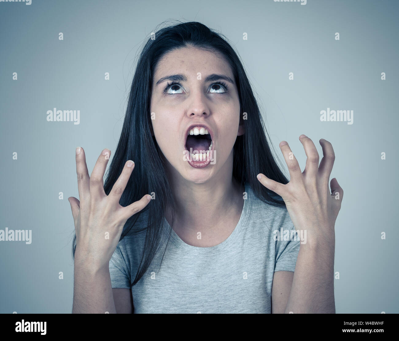 Portrait of young attractive frustrated latin woman with angry and ...