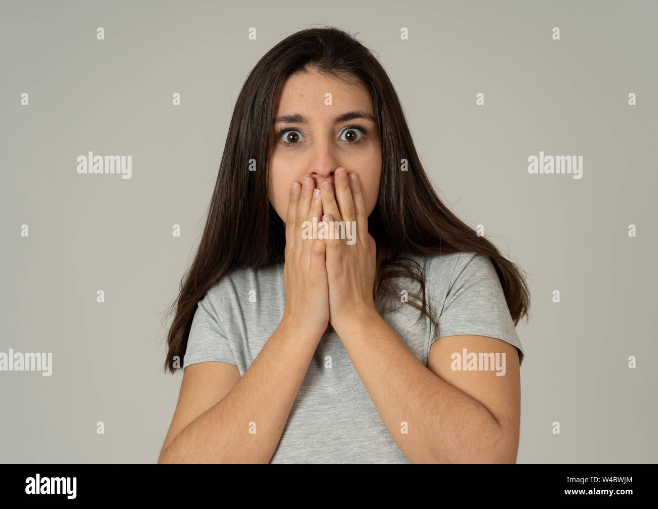 Close up of young woman feeling scared and shocked making fear, anxiety ...