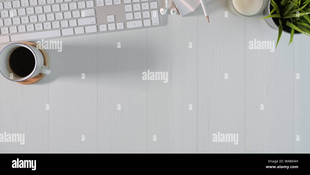 Top view of freelancer's minimal work station with office supplies ...