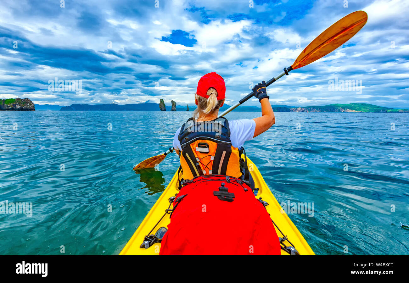 Lady paddling the kayak in the Avacha bay on Kamchatka Peninsula Stock ...