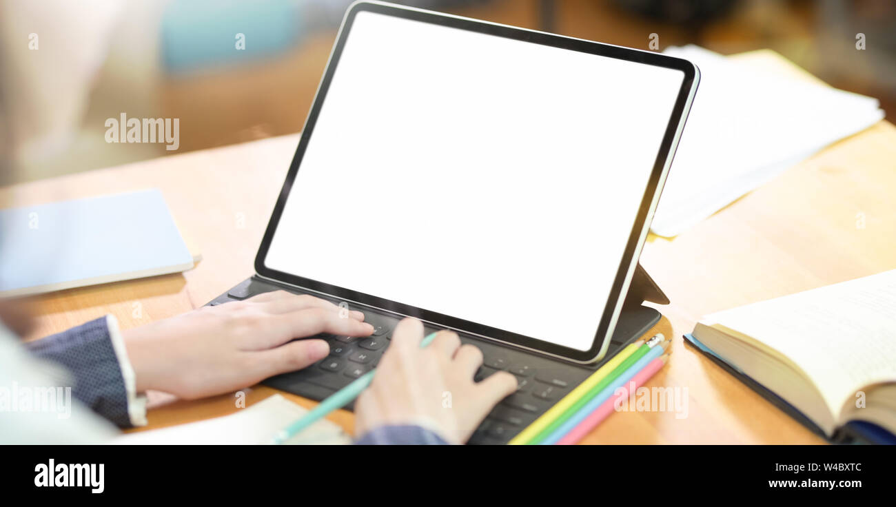 Close-up of young female typing on blank screen laptop in collage ...