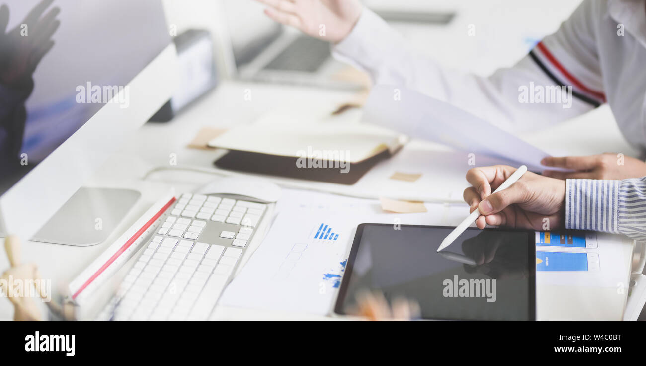 UI UX website development team sketching wireframe layout for responsive web content in studio ...