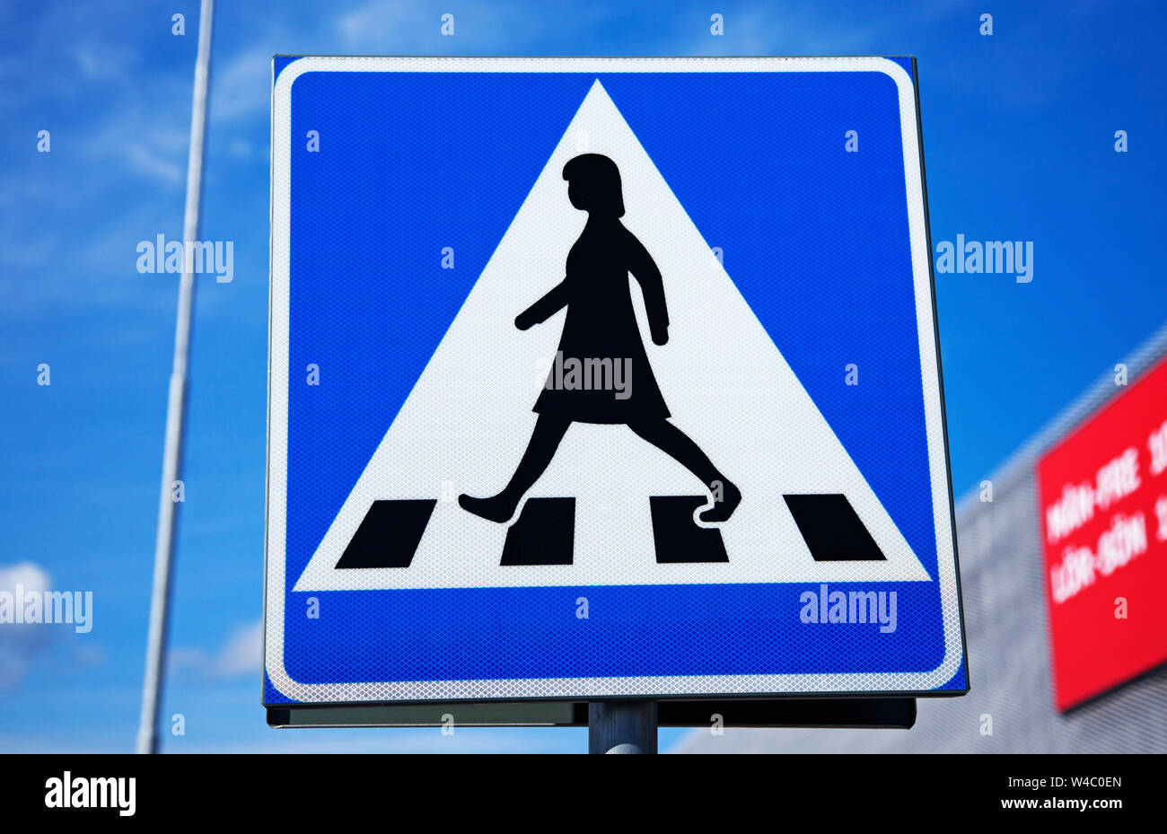 traffic sign for pedestrian crossing with female figure Stock Photo - Alamy