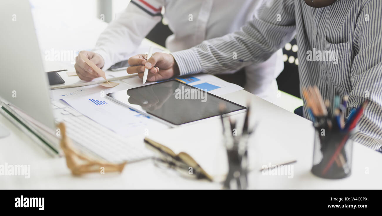 Team business meeting and discussing new project with document and ...