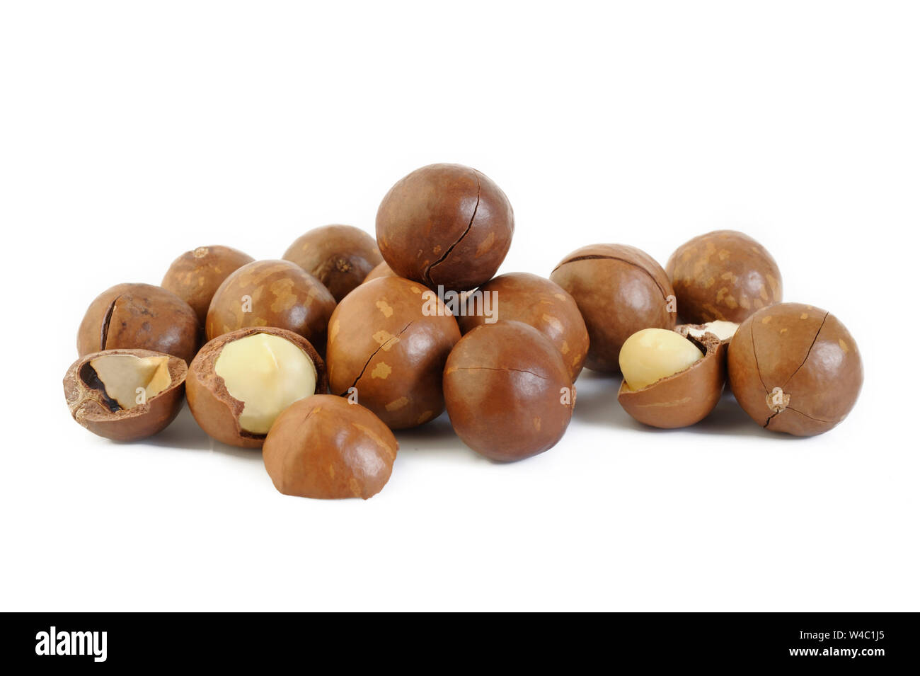 macadamia nuts on white background Stock Photo - Alamy