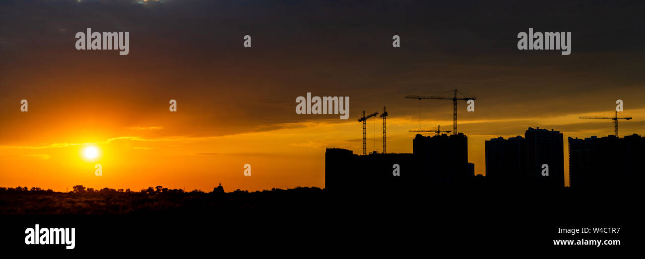 Construction Site of apartment house on sunset Stock Photo - Alamy