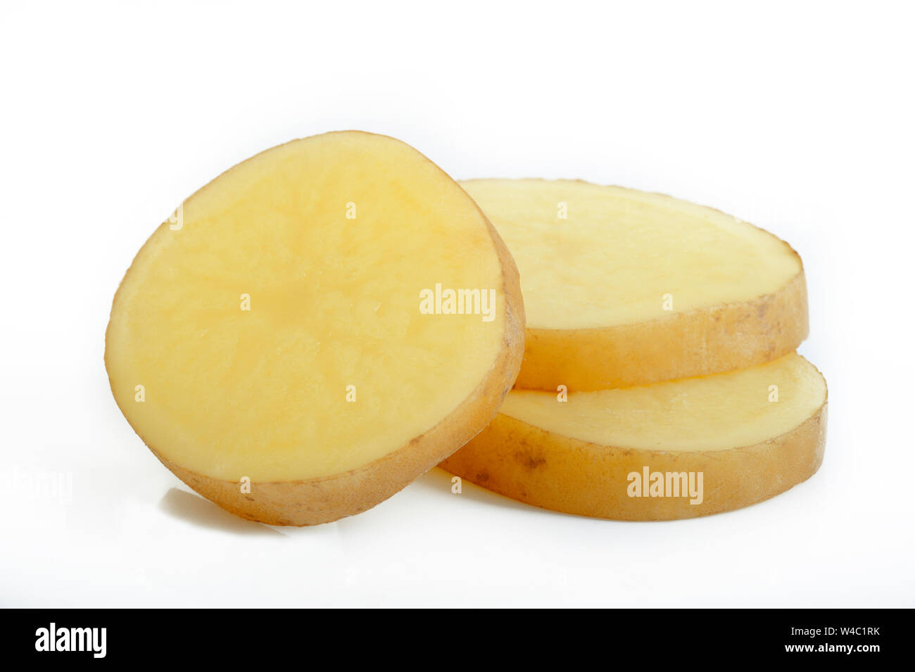 Fresh sliced potatoes on white background Stock Photo - Alamy