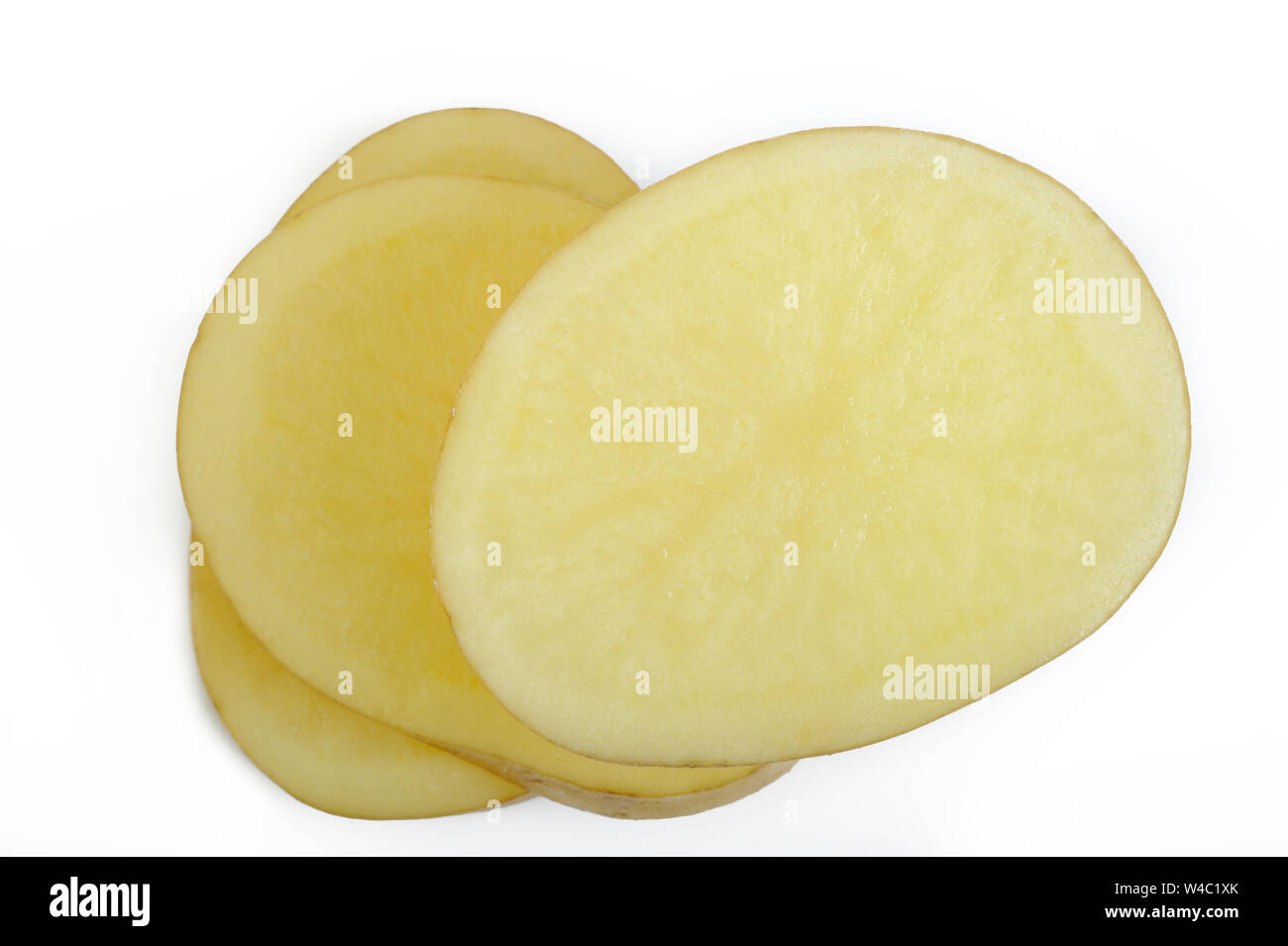 fresh sliced potatoes on white background Stock Photo - Alamy